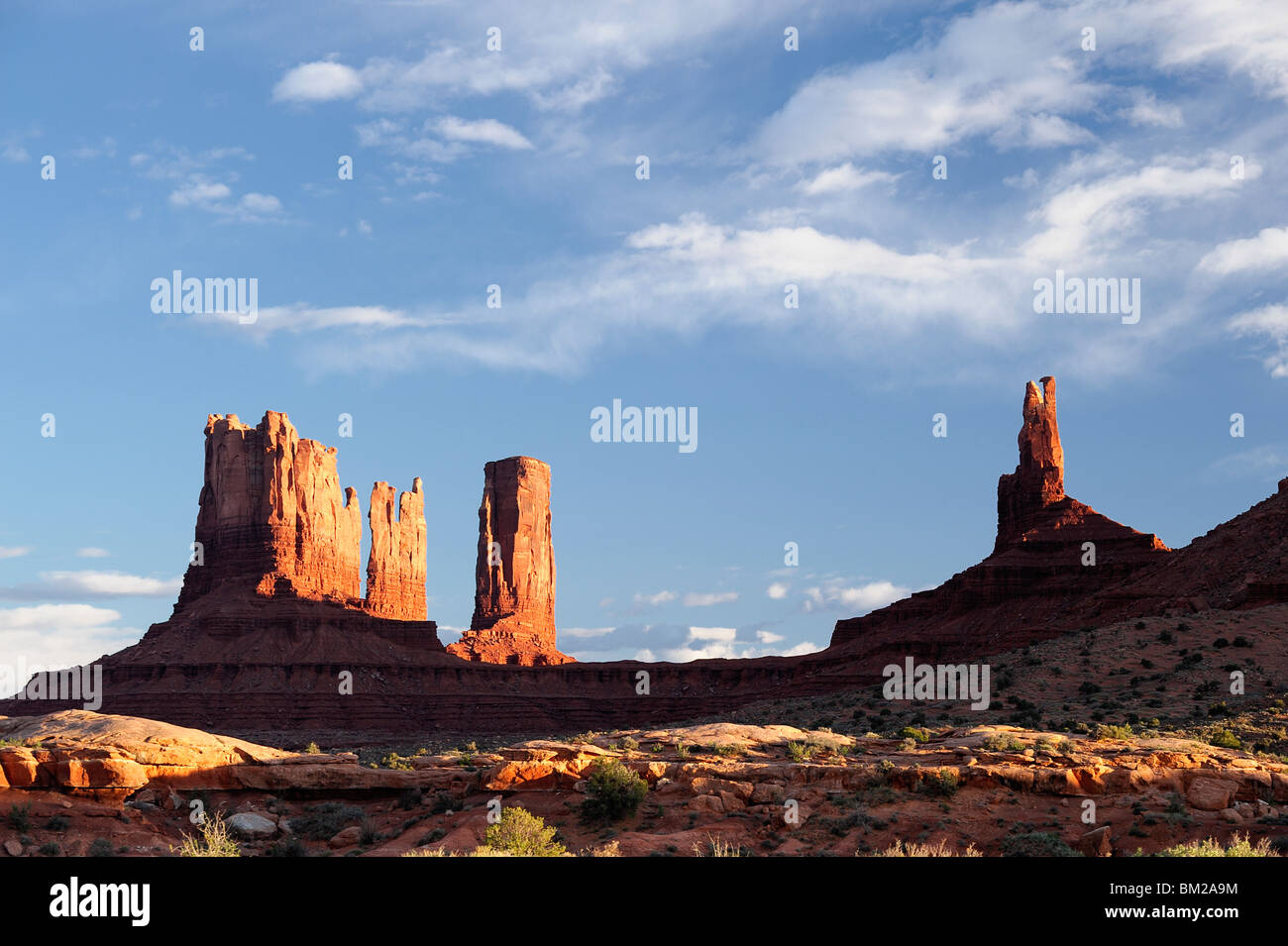 Monument Valley - the rock formation known as the stagecoach glows as ...