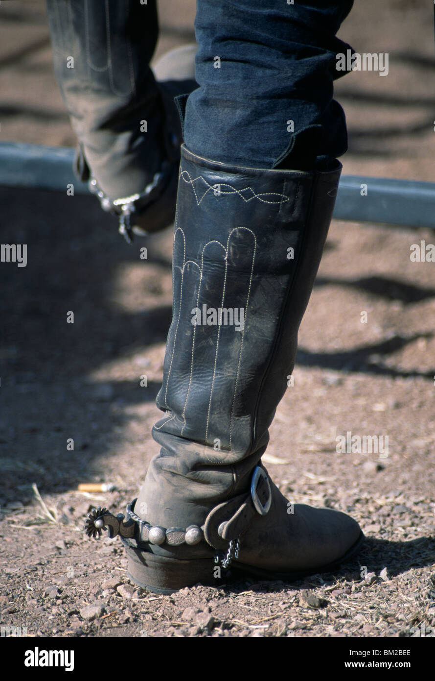 Low section view of a cowboy wearing jeans Stock Photo - Alamy
