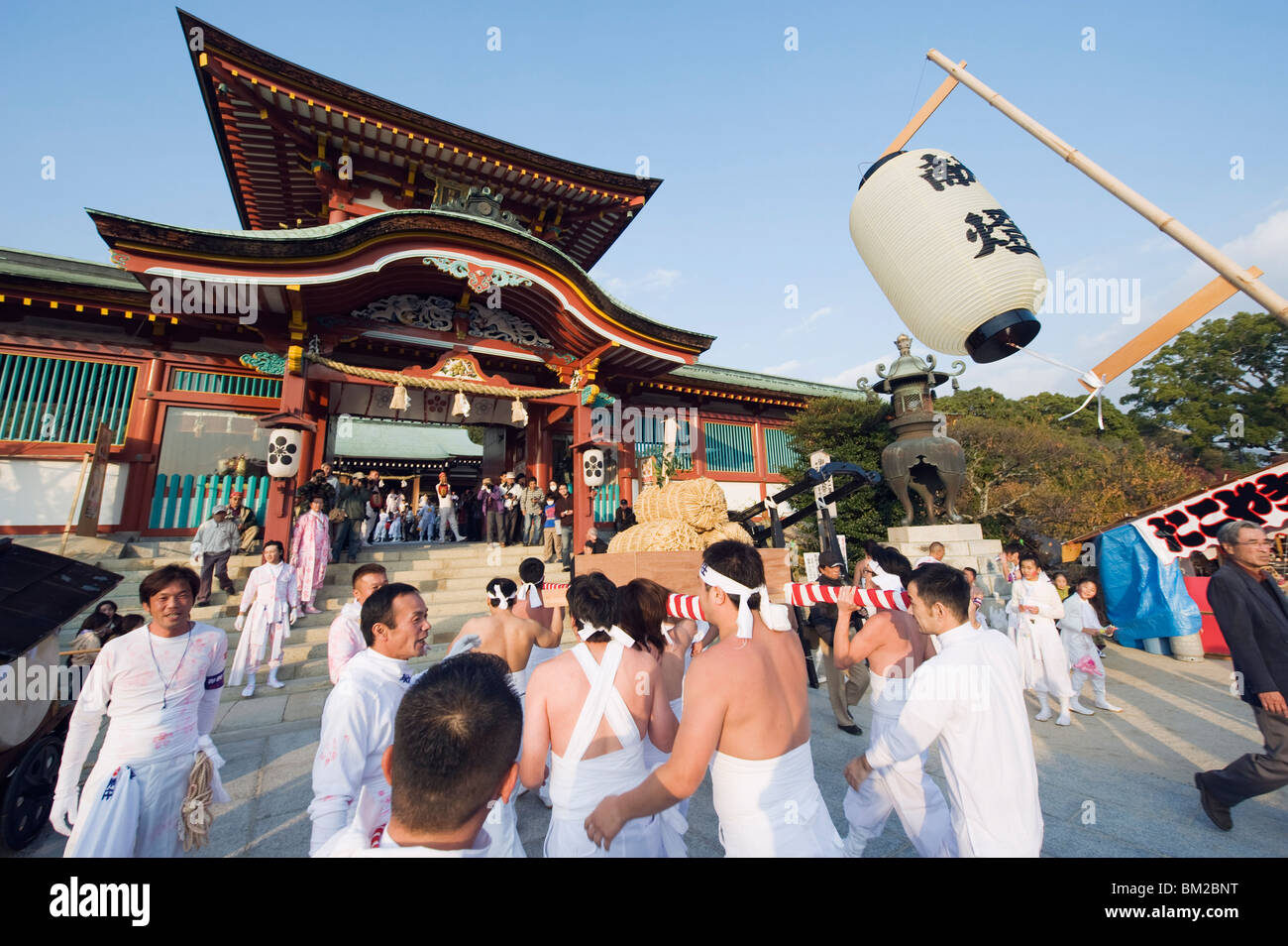 Rice bales being carried at Hadaka Matsuri (Naked Festival), Hofu city, Yamaguchi Prefecture ...