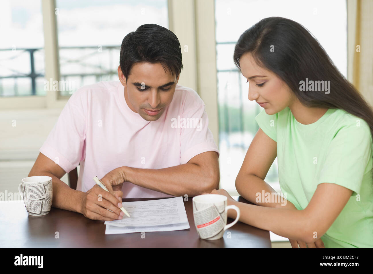 Two women and paperwork home women only hi-res stock photography and ...