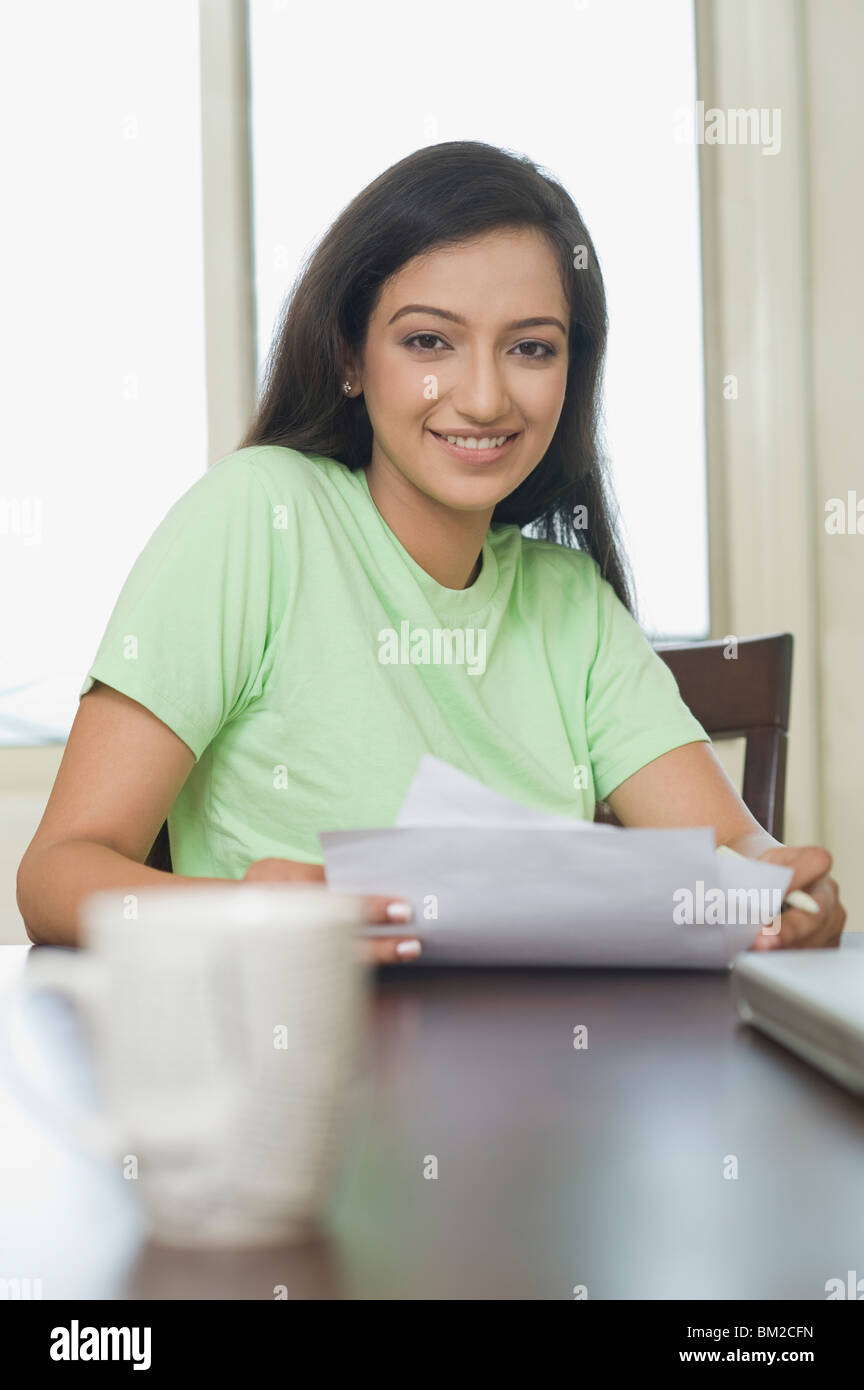 Young asian woman doing paperwork hi-res stock photography and images ...