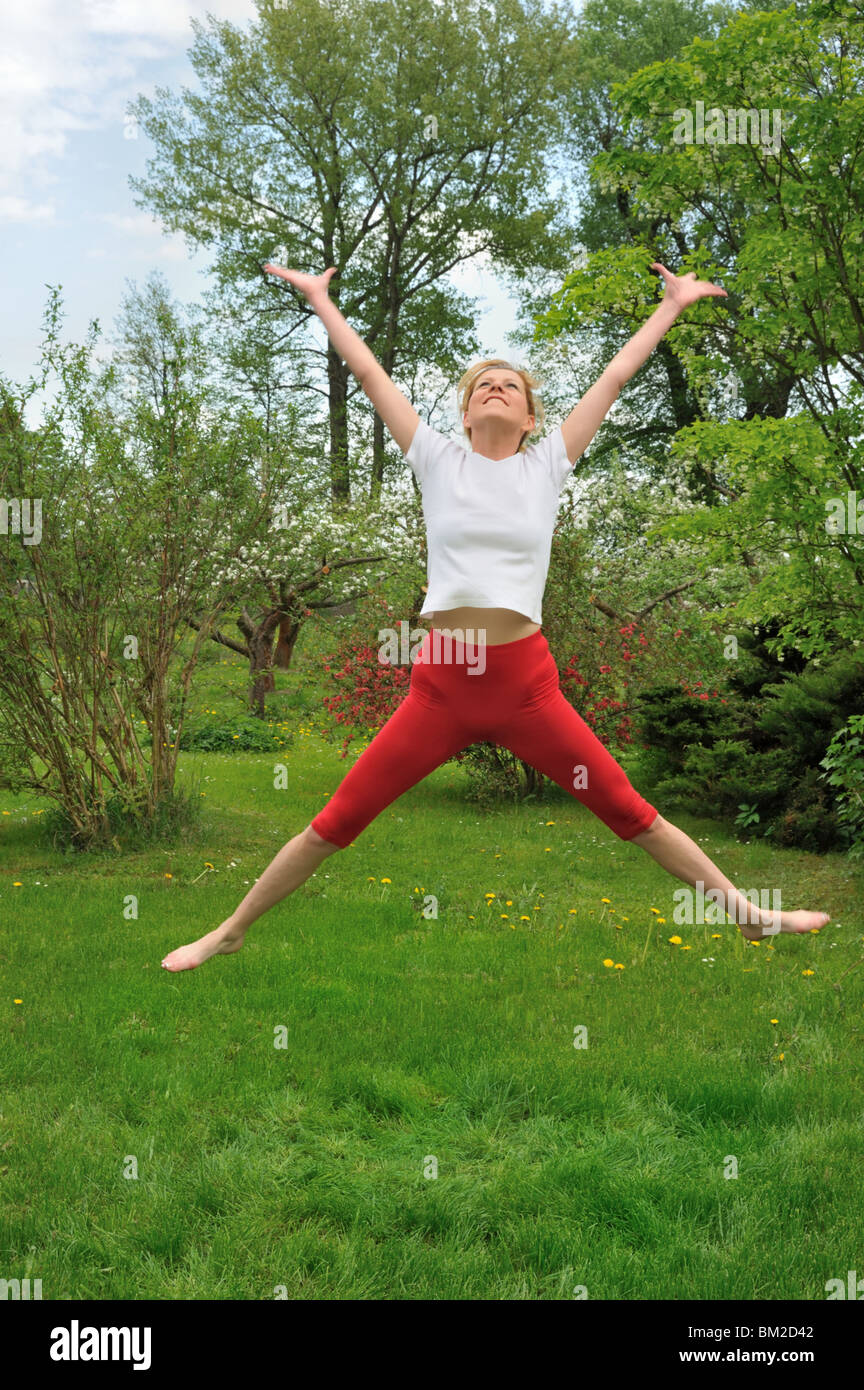 Young woman practising - jumping - outdoor Stock Photo - Alamy