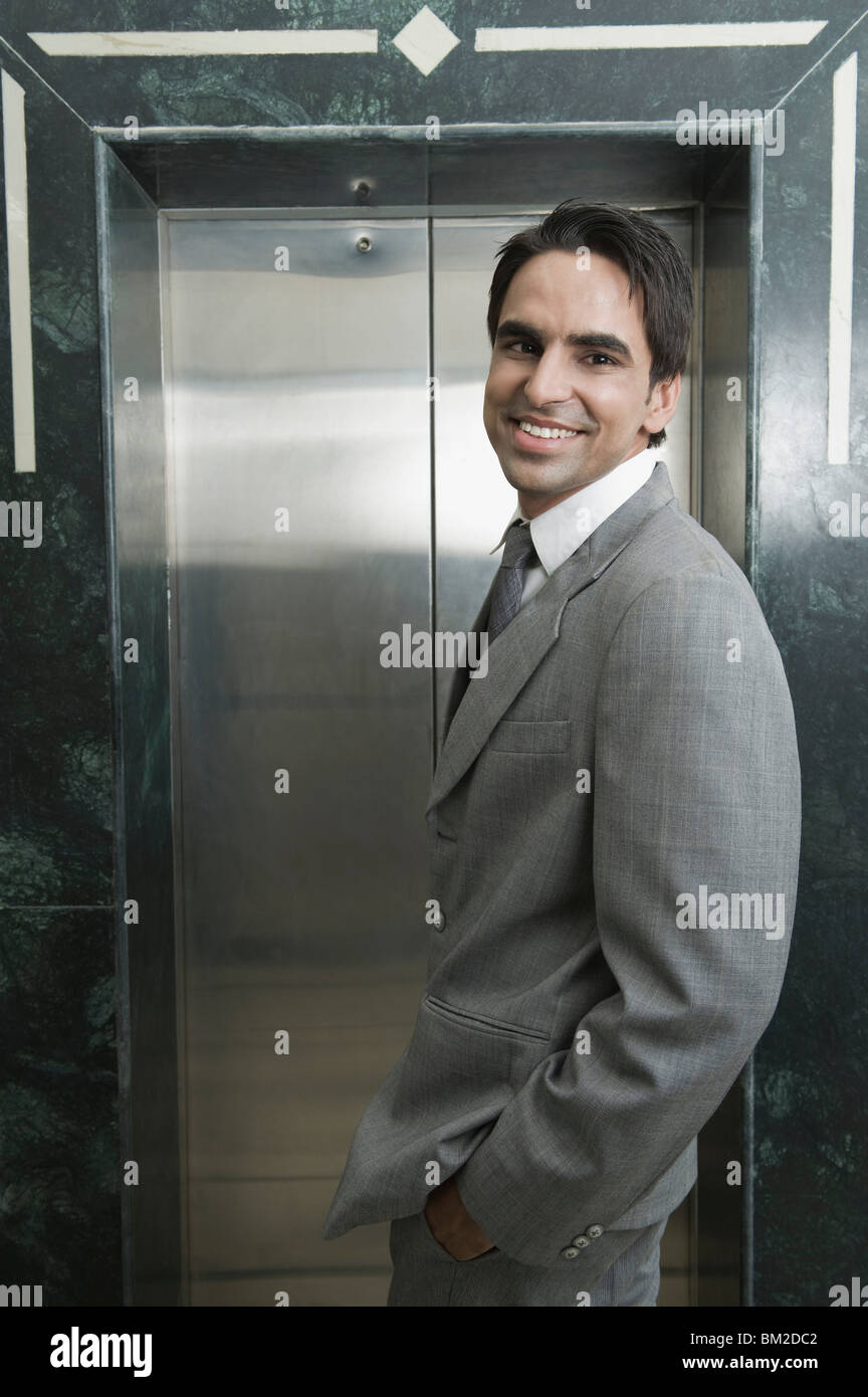 Businessman waiting in front lift hi-res stock photography and images ...