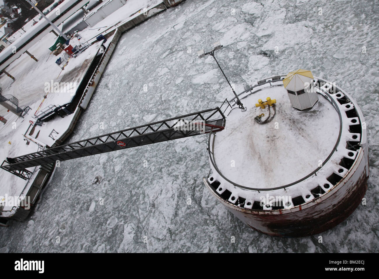 BALTIC SEA HARBOUR IN THICK ICE: Ferry docks in Winter frozen sea at ...