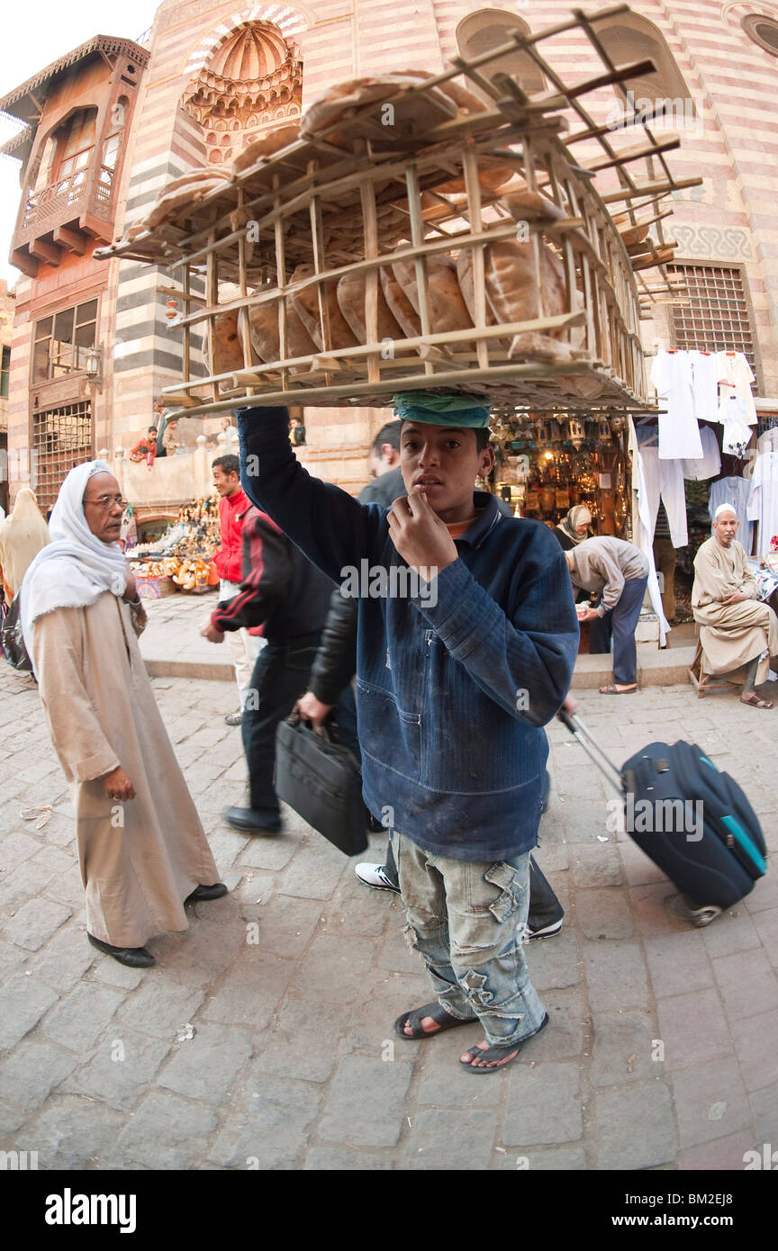 Man carrying bread on head hi-res stock photography and images - Alamy