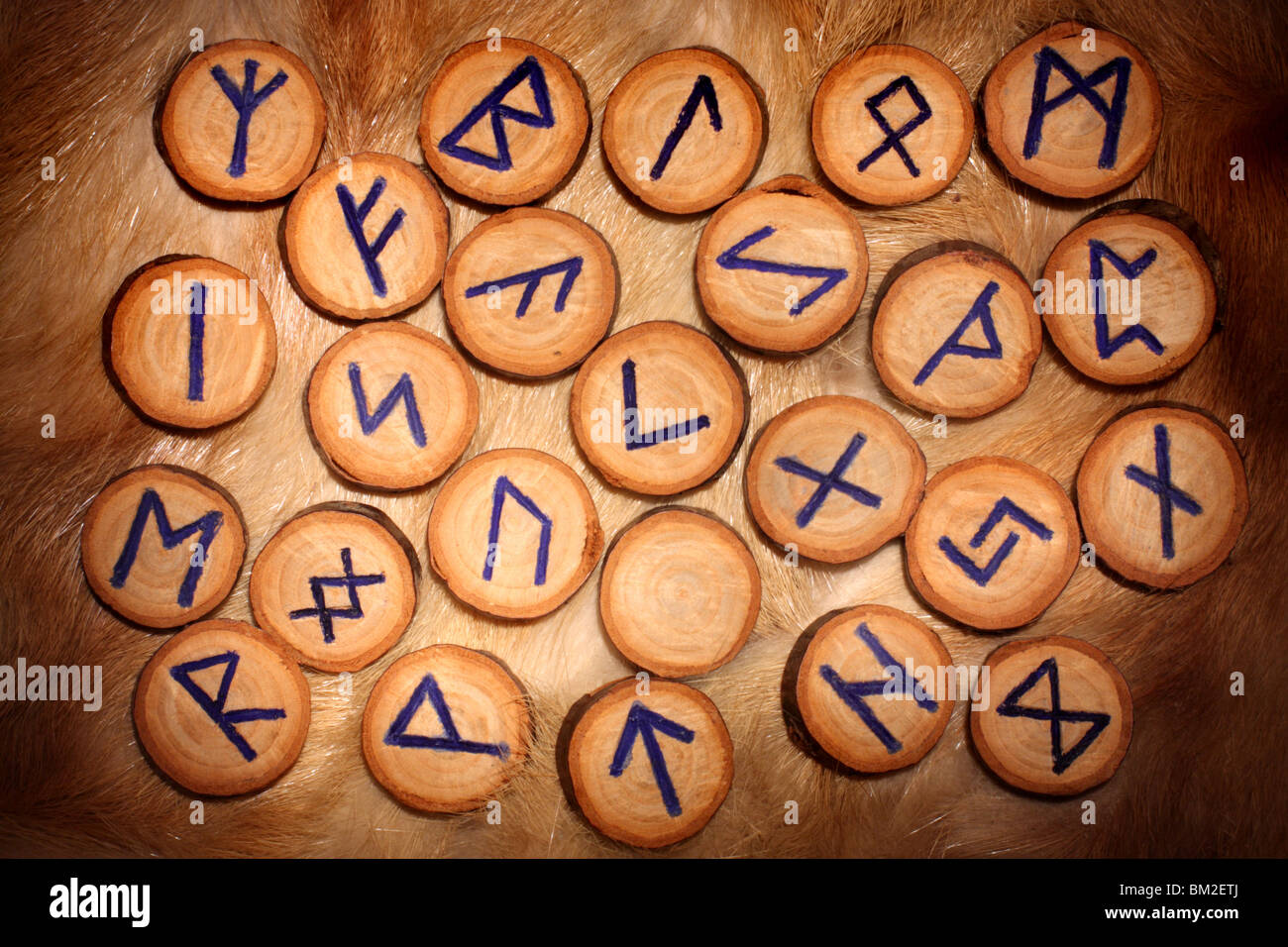 Handmade rune set on the fur Stock Photo - Alamy