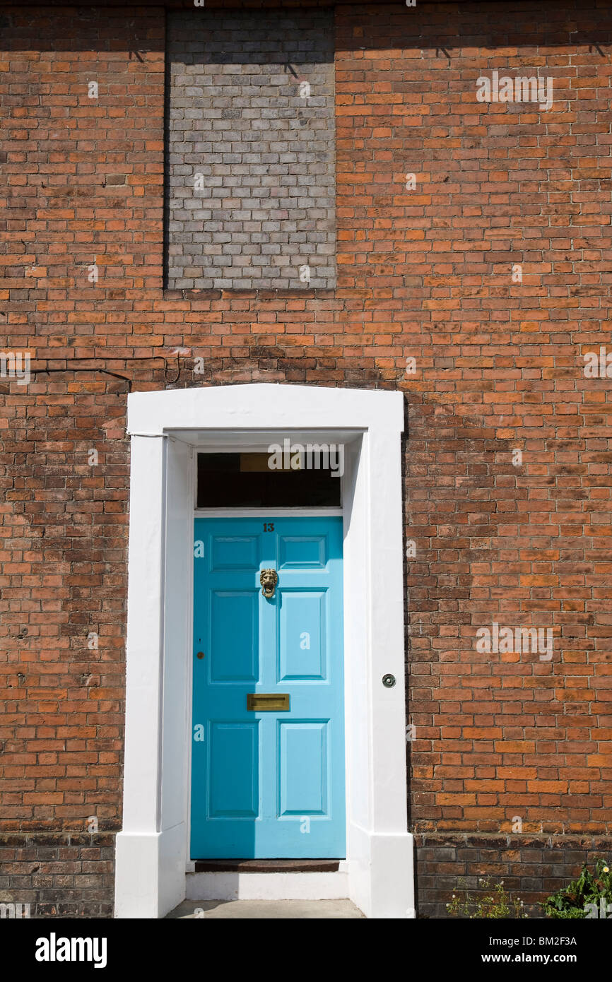 A bright blue Georgian door and a bricked up window, Chichester, West ...