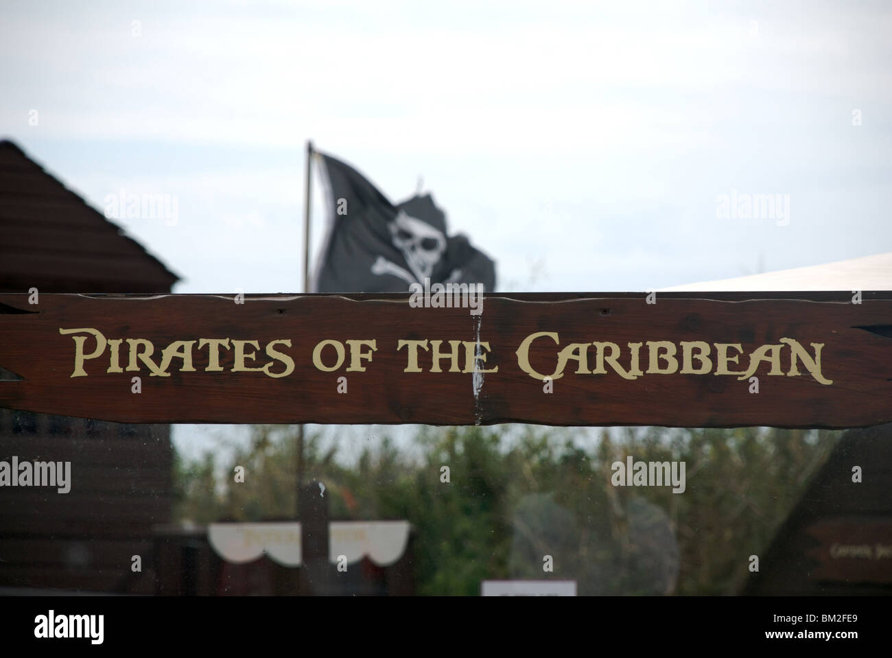 Pirates of the Caribbean sign with Skull and Crossbones flag in ...