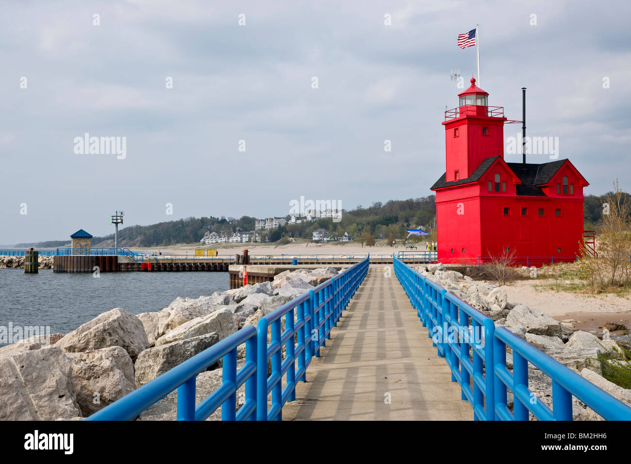 Low angle distant view of Big Red Lighthouse and boardwalk with safety ...