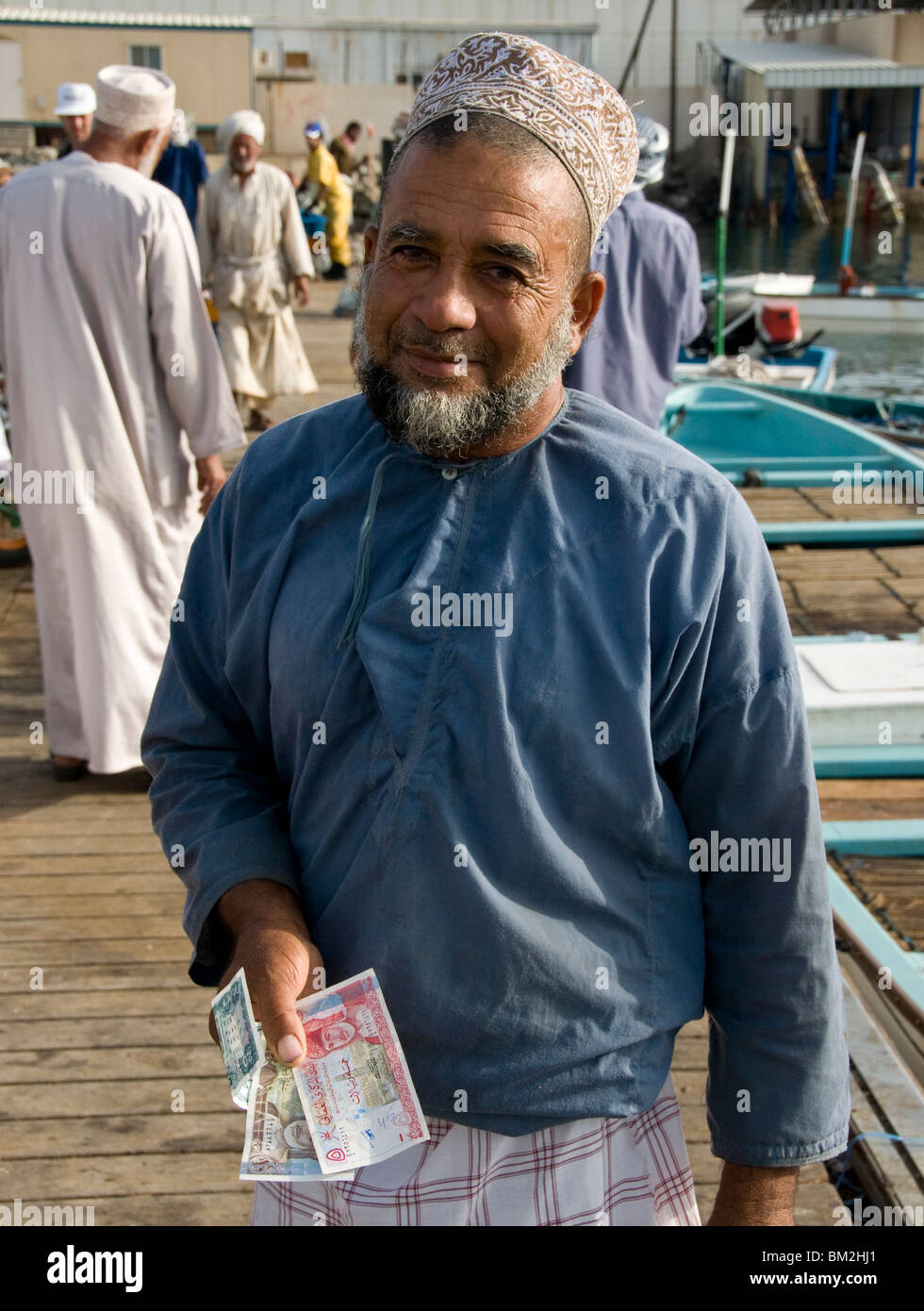 Trader at the fish market Mutrah Muscat Oman Stock Photo - Alamy