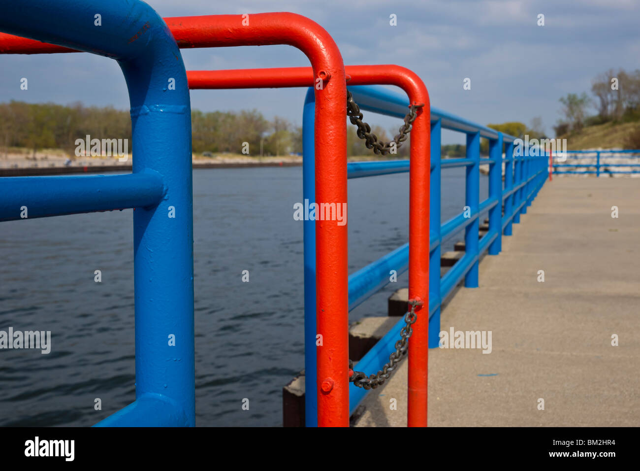 Red and blue safety rails in Holland Harbor on Lake Michigan hi-res Stock Photo - Alamy