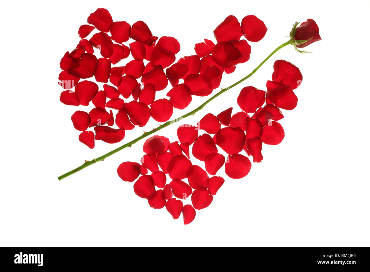 Cupid arrow in a red rose petals heart shape, love symbol Stock Photo ...