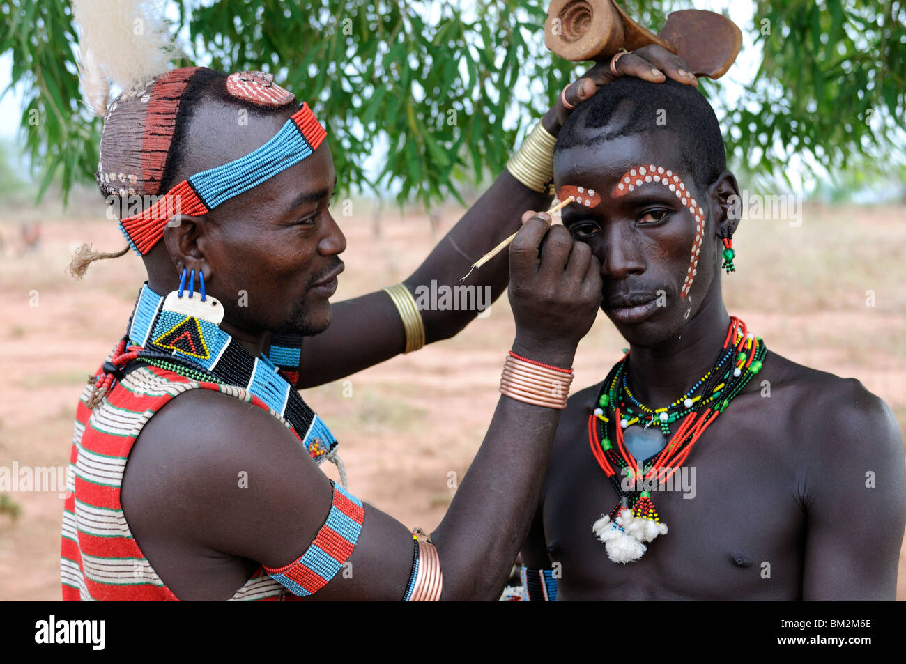 Two men from the Hamer tribe preparing for the Jumping of the Bull ...