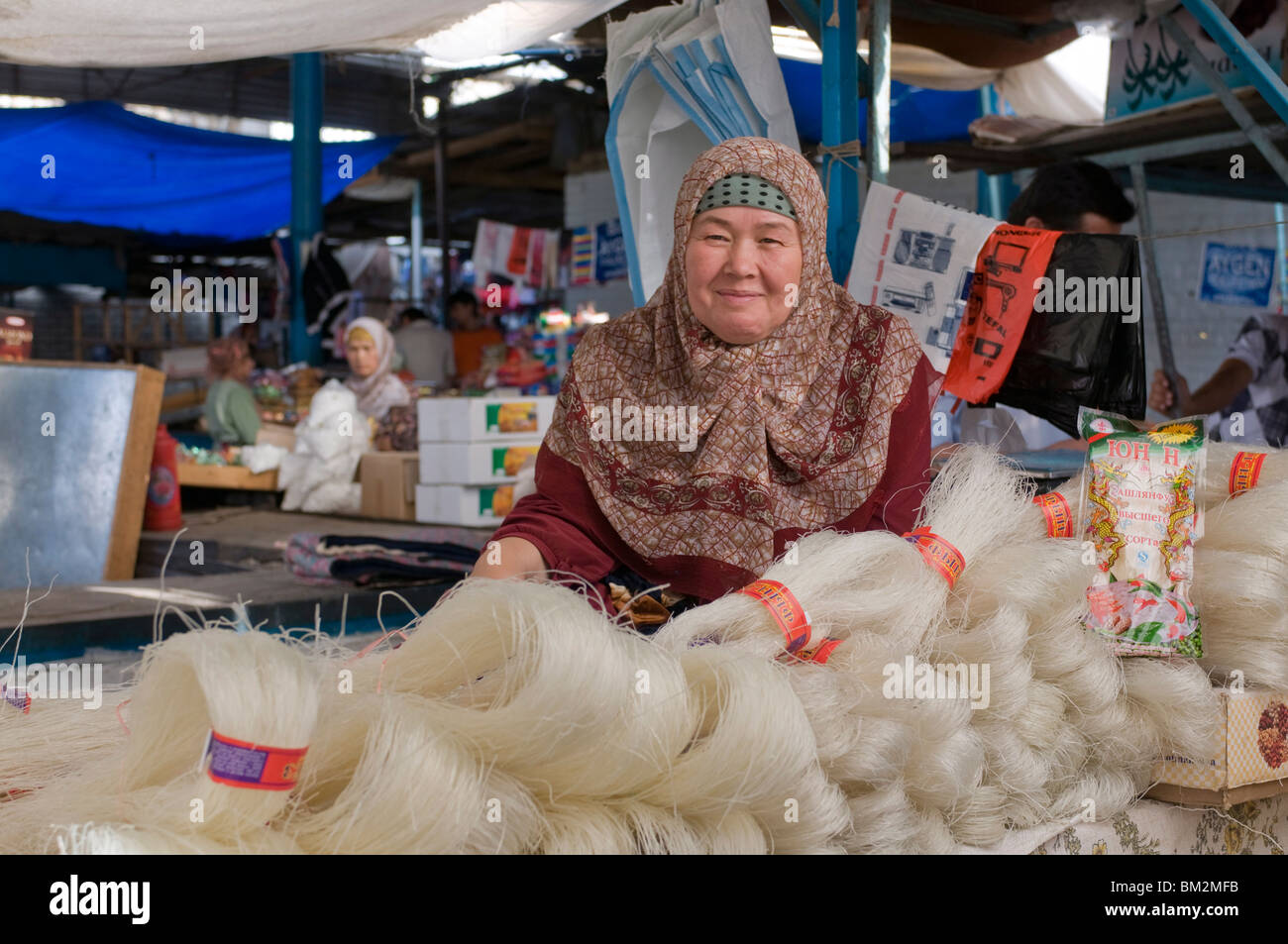 Woman selling rice noodles, Osh, Kyrgyzstan Stock Photo - Alamy