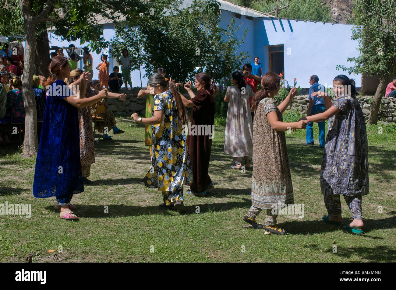 Dancing guests at wedding at Pamiris, Bartang Valley, Tajikistan Stock ...