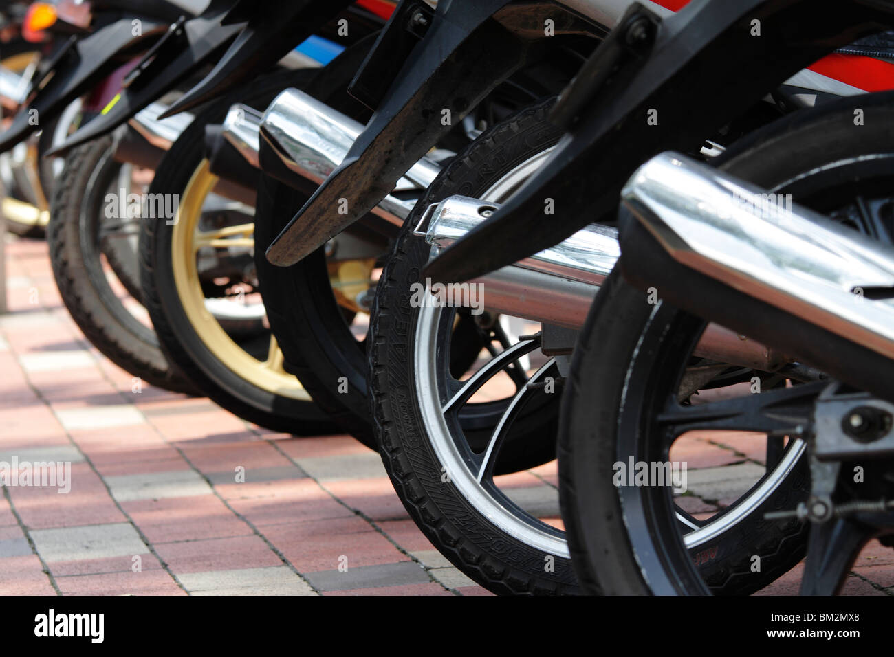 A row of motorcycles parked outdoors Stock Photo - Alamy