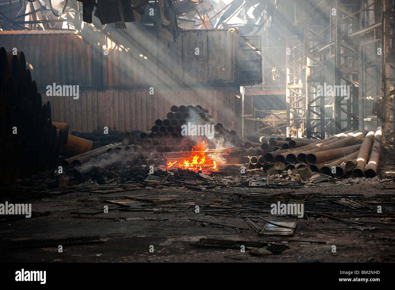 Large factory and warehouse collapsed and smoldering following major ...