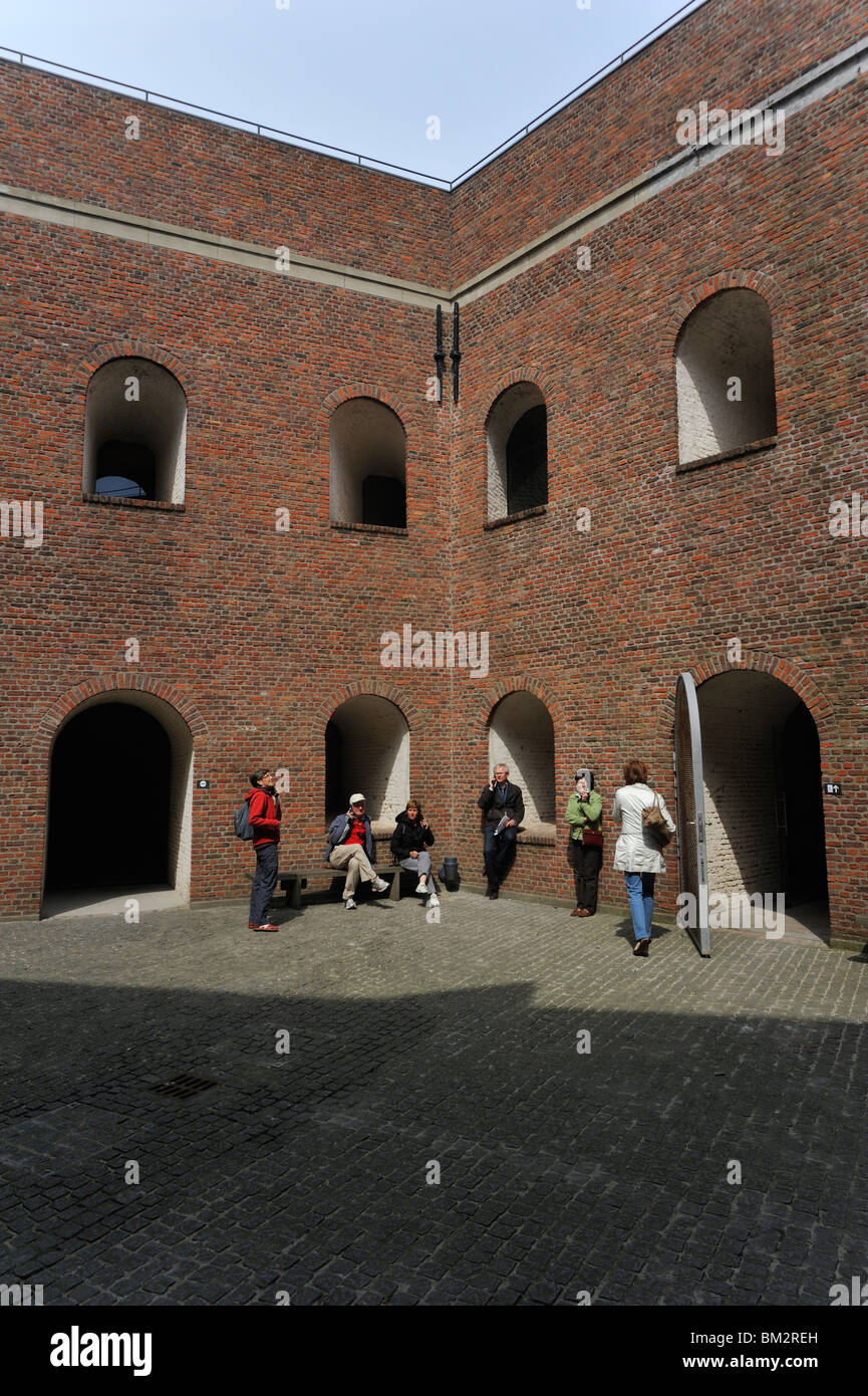 Tourists with audio guides visiting the pentagonal inner court of the ...