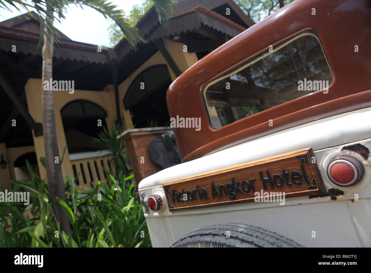 A classic car parked outside the Victoria Angkor Hotel in Siem Reap ...