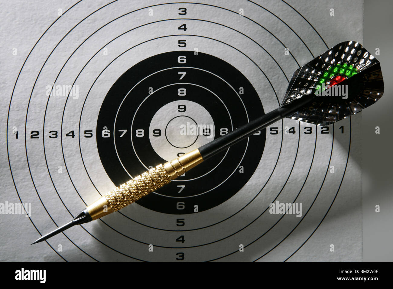 Black and white target with dart and shadows, close up macro Stock ...