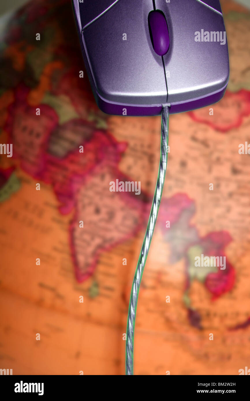 Computer wired mouse over the world colorful global earth map Stock ...