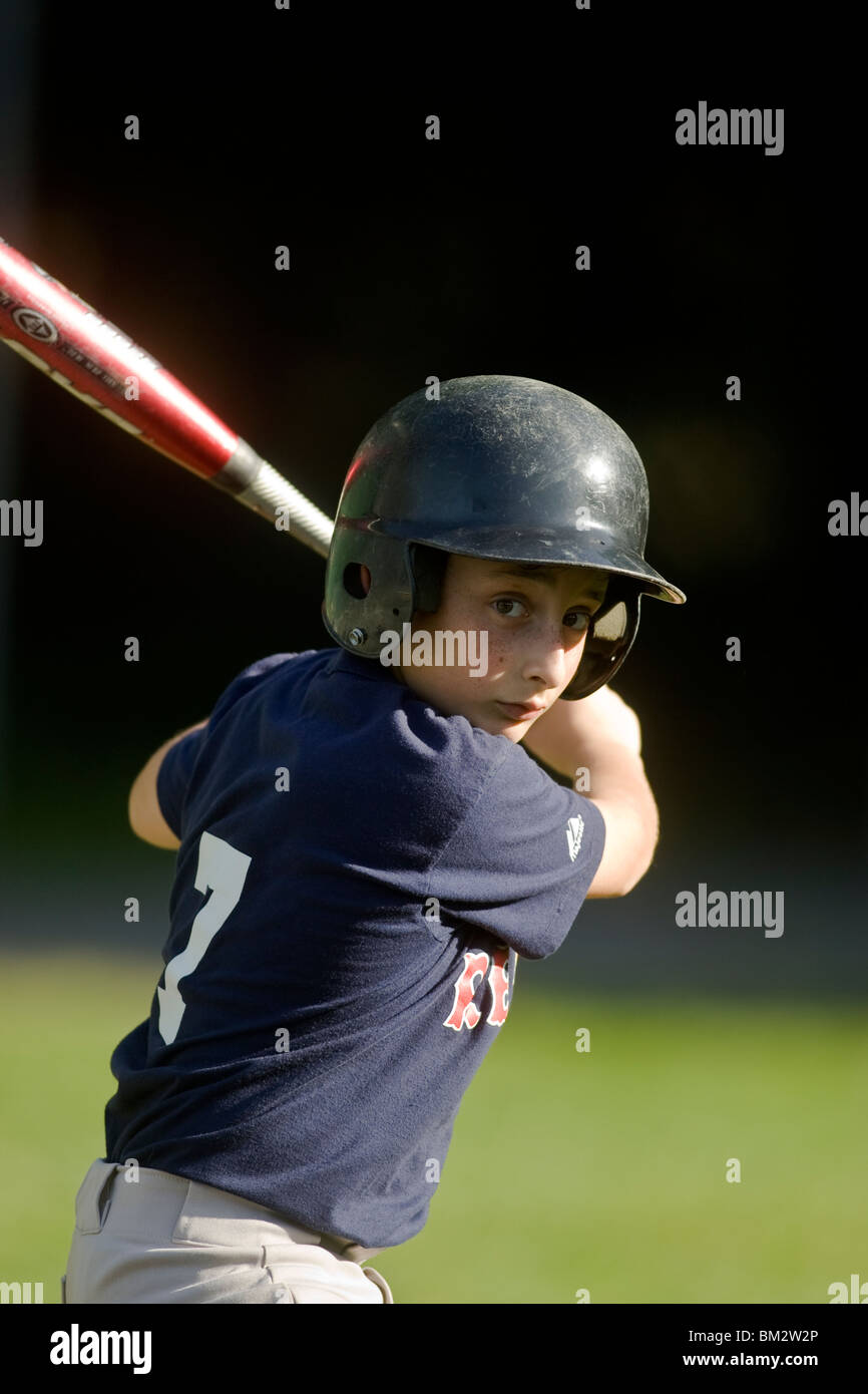 10 year old boy batting during little league baseball game Stock Photo ...
