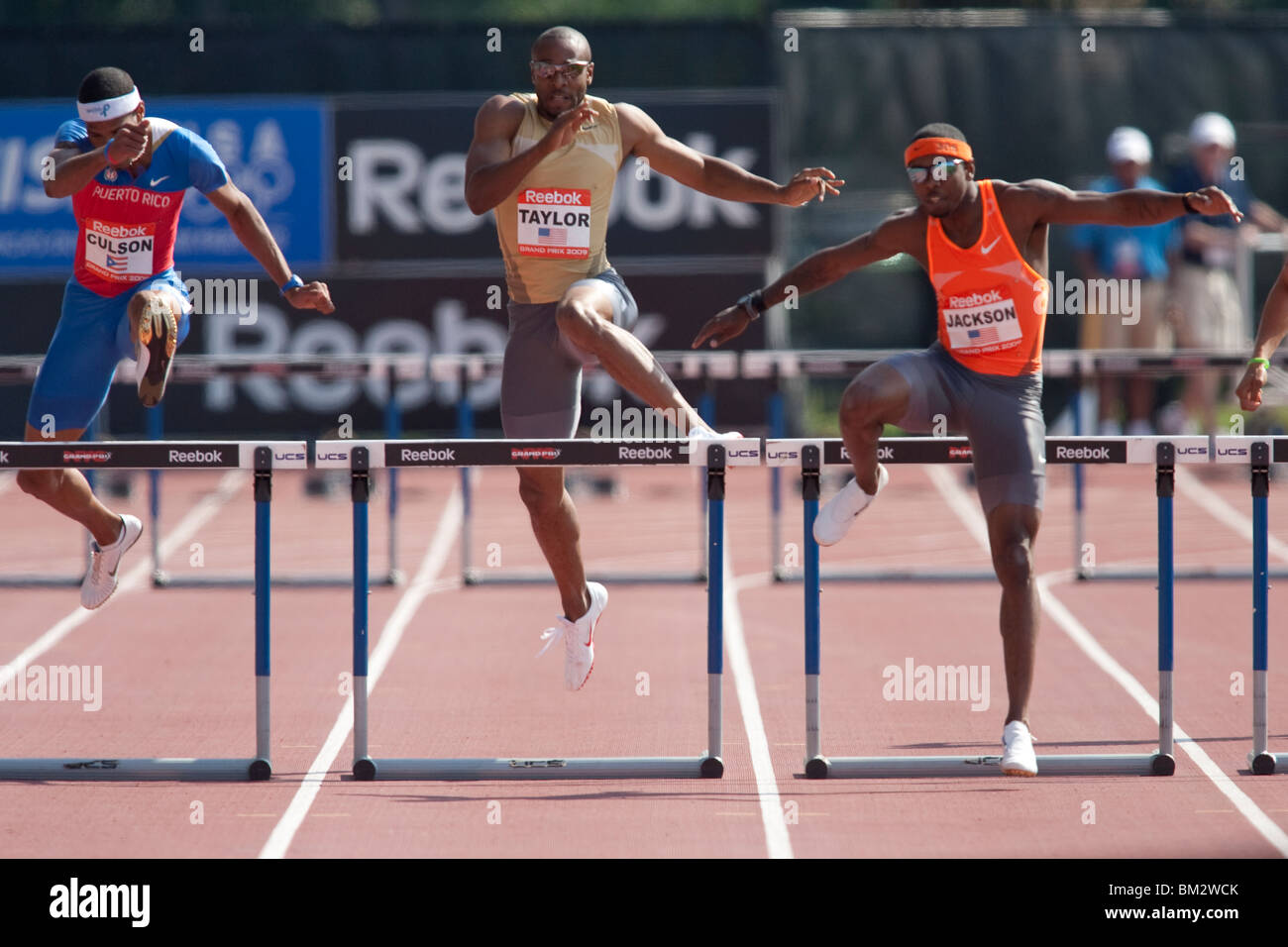 Bershawn Jackson (USA) -C-winner, Angelo Taylor (USA)- L- and James ...
