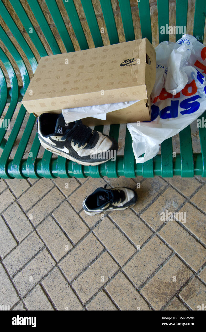 New trainer box with discarded old trainers Stock Photo - Alamy