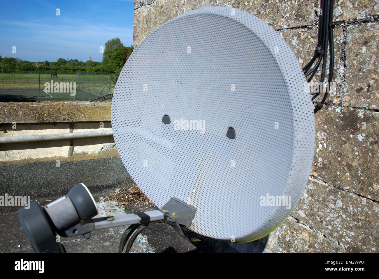Satellite television dish on house, England, UK Stock Photo - Alamy