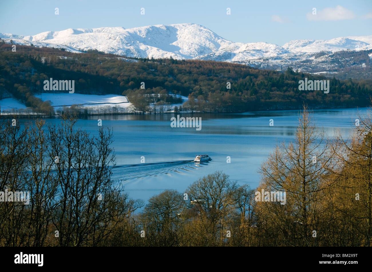 A pleasure boat on Lake Windermere in winter, Lake District, Cumbria ...