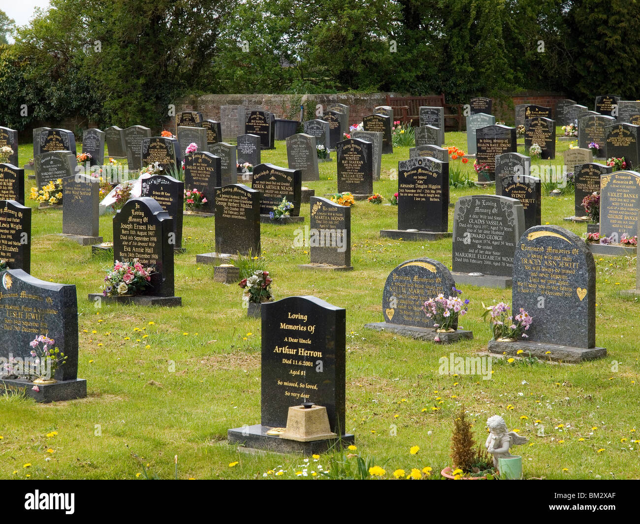 A well tended cemetery with lines of gravestones upright and well ...