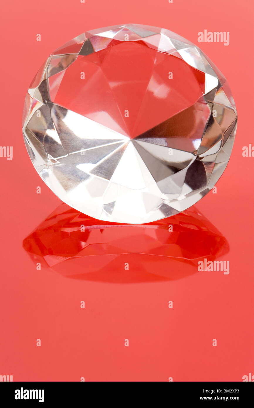 Diamond close up shot with red background Stock Photo - Alamy