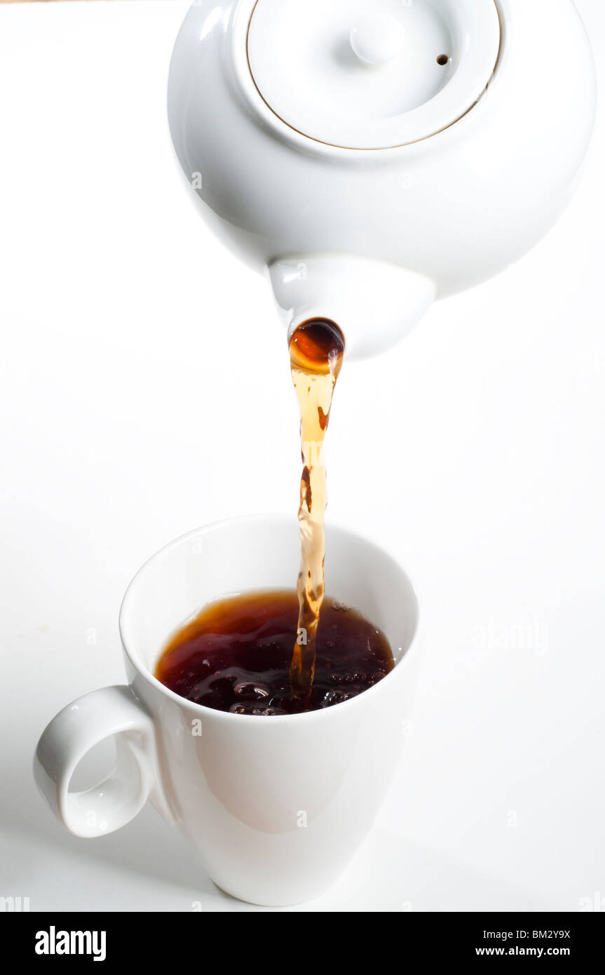 Tea being poured into tea cup hi-res stock photography and images - Alamy