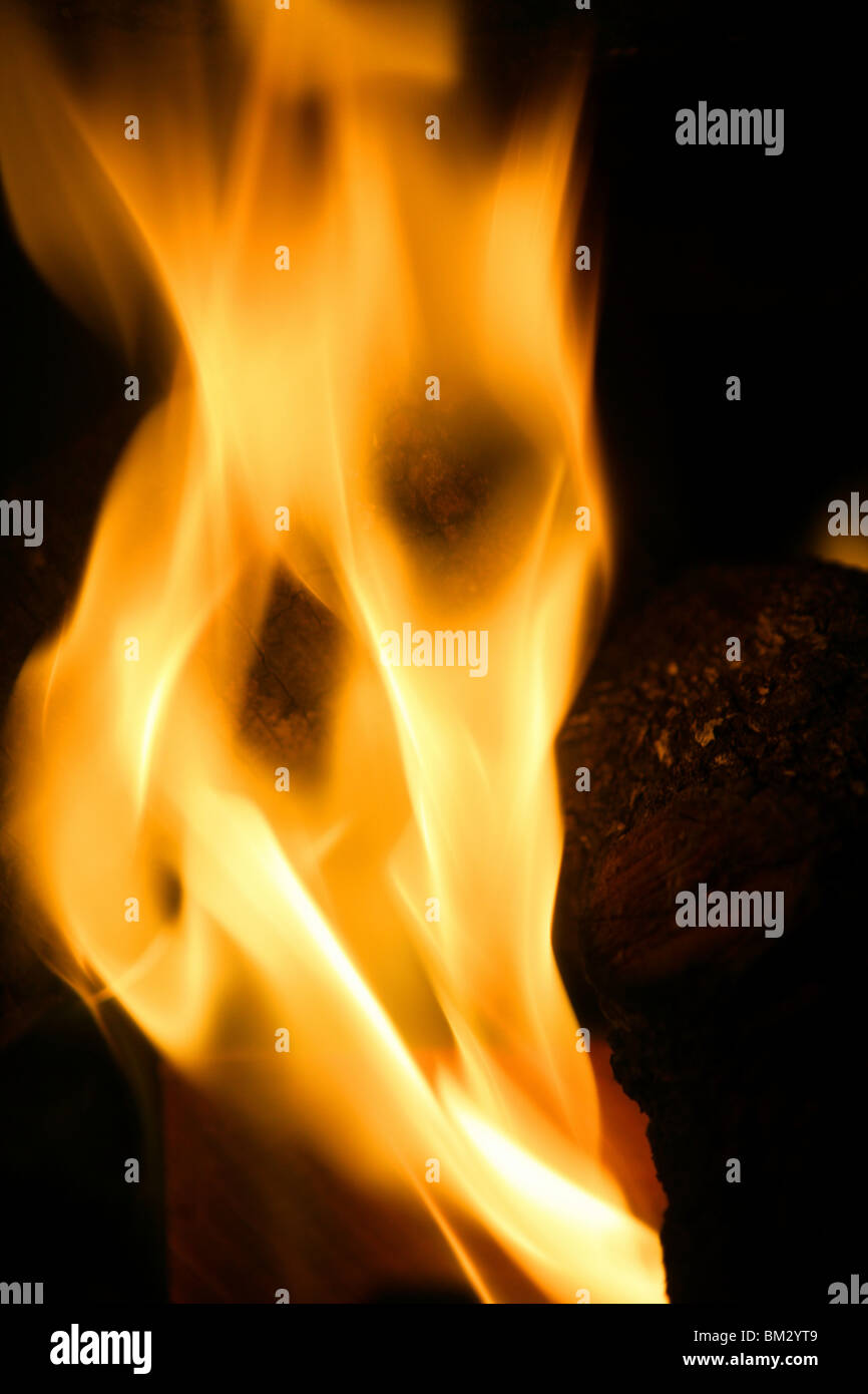 Orange fire burning flames over black background Stock Photo - Alamy