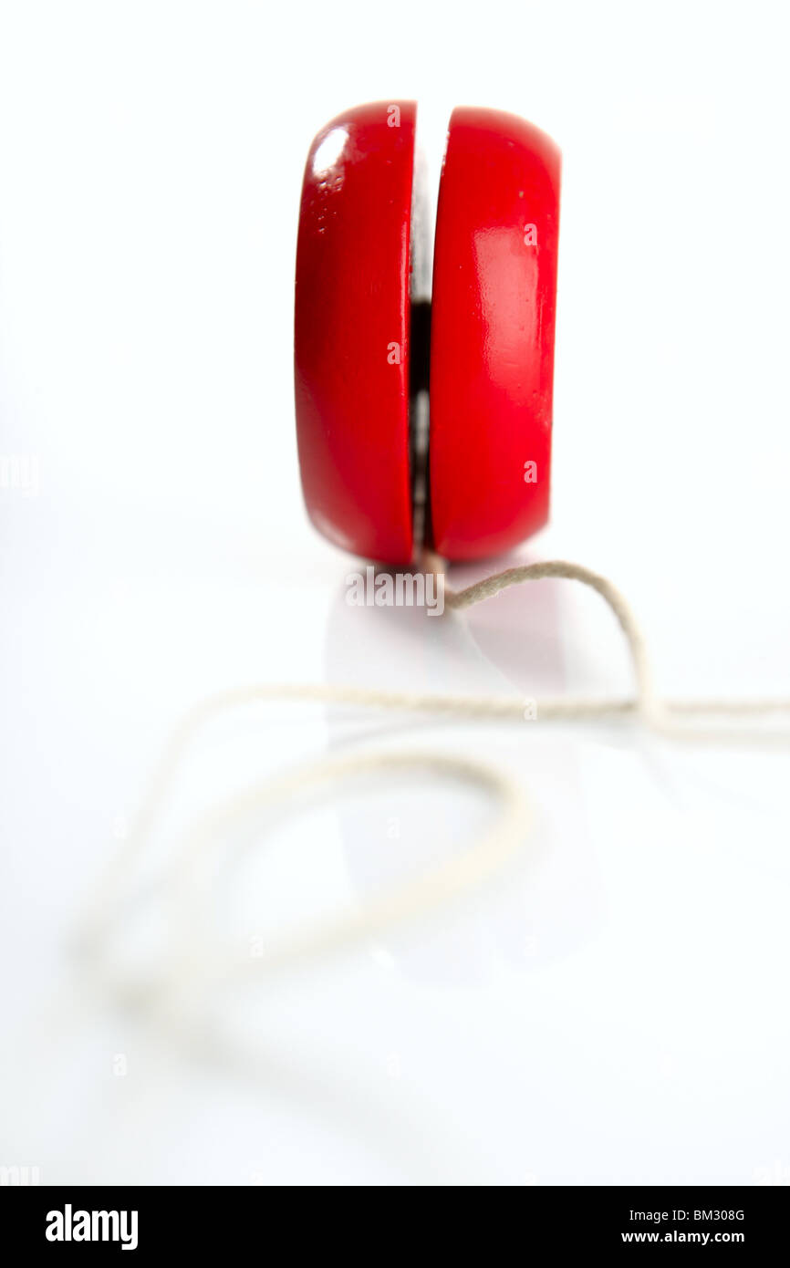 Red yoyo with thread isolated over white background Stock Photo - Alamy