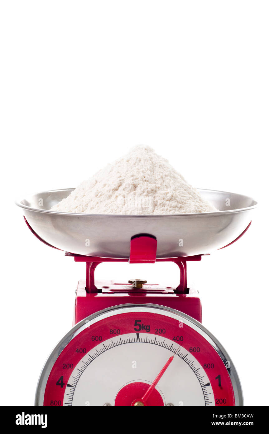 Red weighing scales with flour Stock Photo - Alamy
