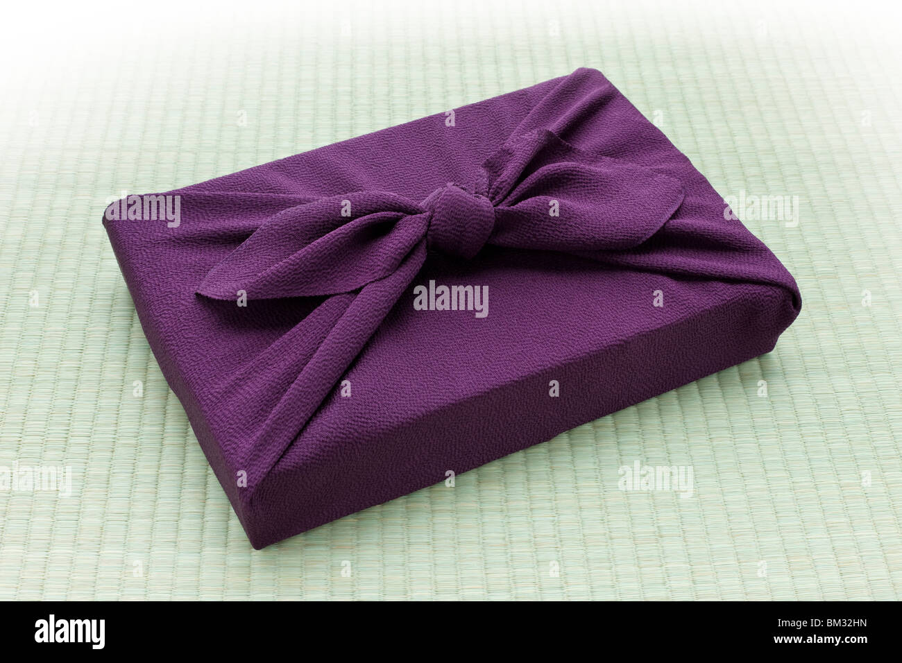 Box wrapped in purple cloth on Tatami mat Stock Photo - Alamy