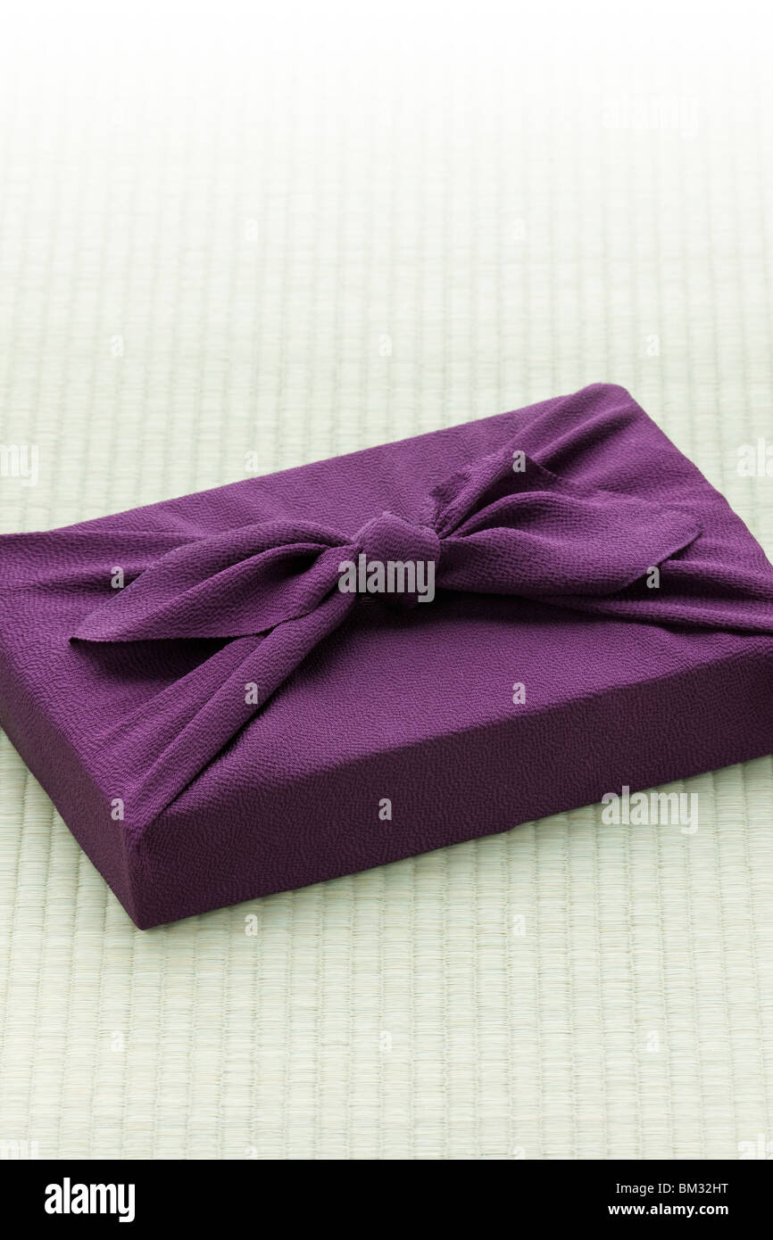 Box wrapped in purple cloth on Tatami mat Stock Photo - Alamy