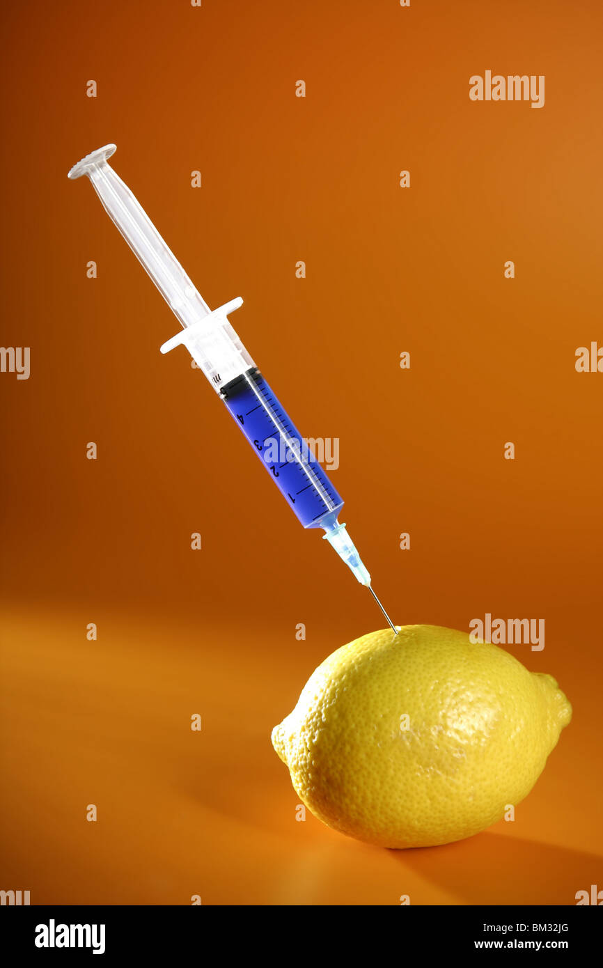 Bio genetics research of food , modified lemon with syringe Stock Photo ...