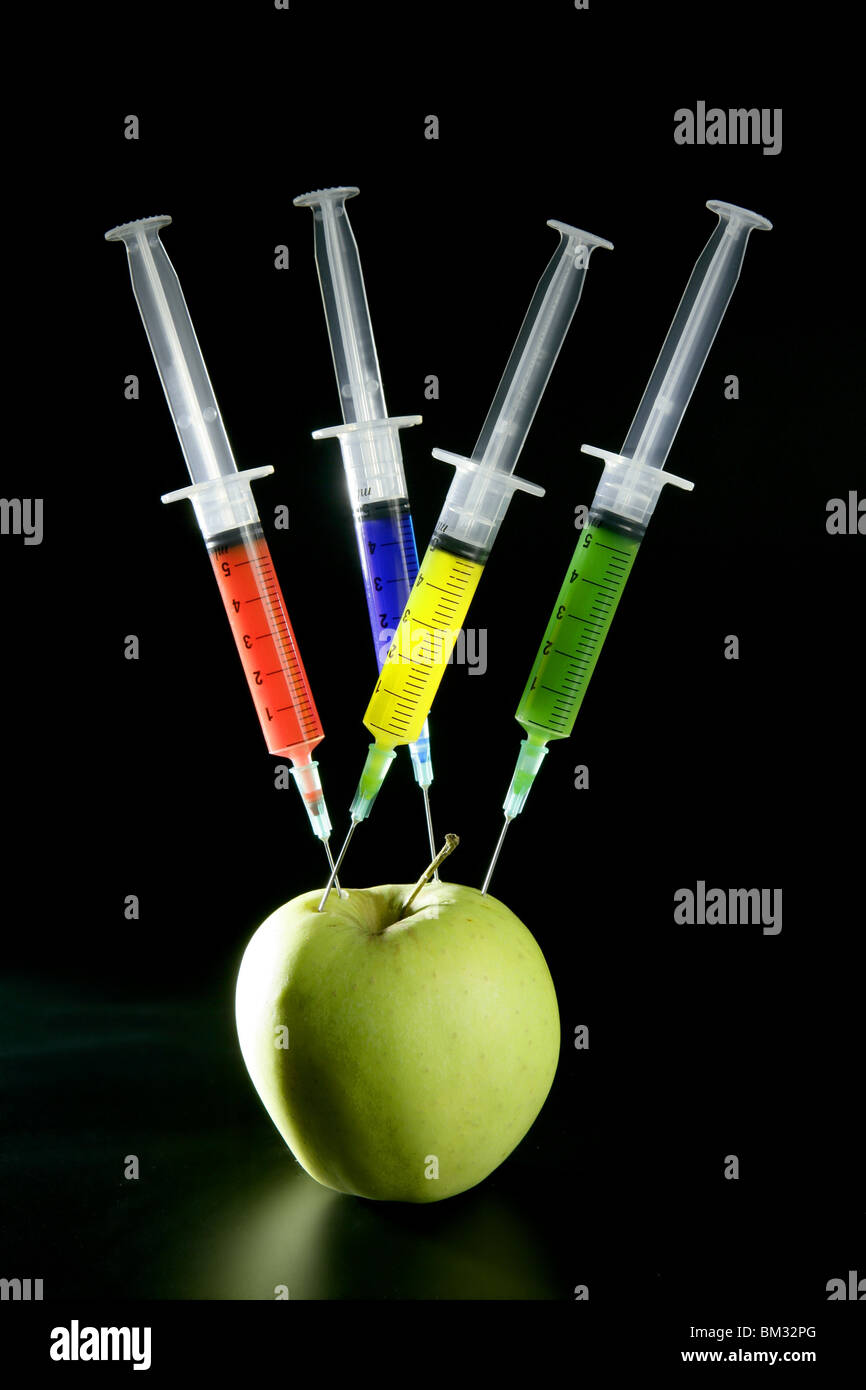 Bio genetics research of food , apple manipulation with syringe Stock ...