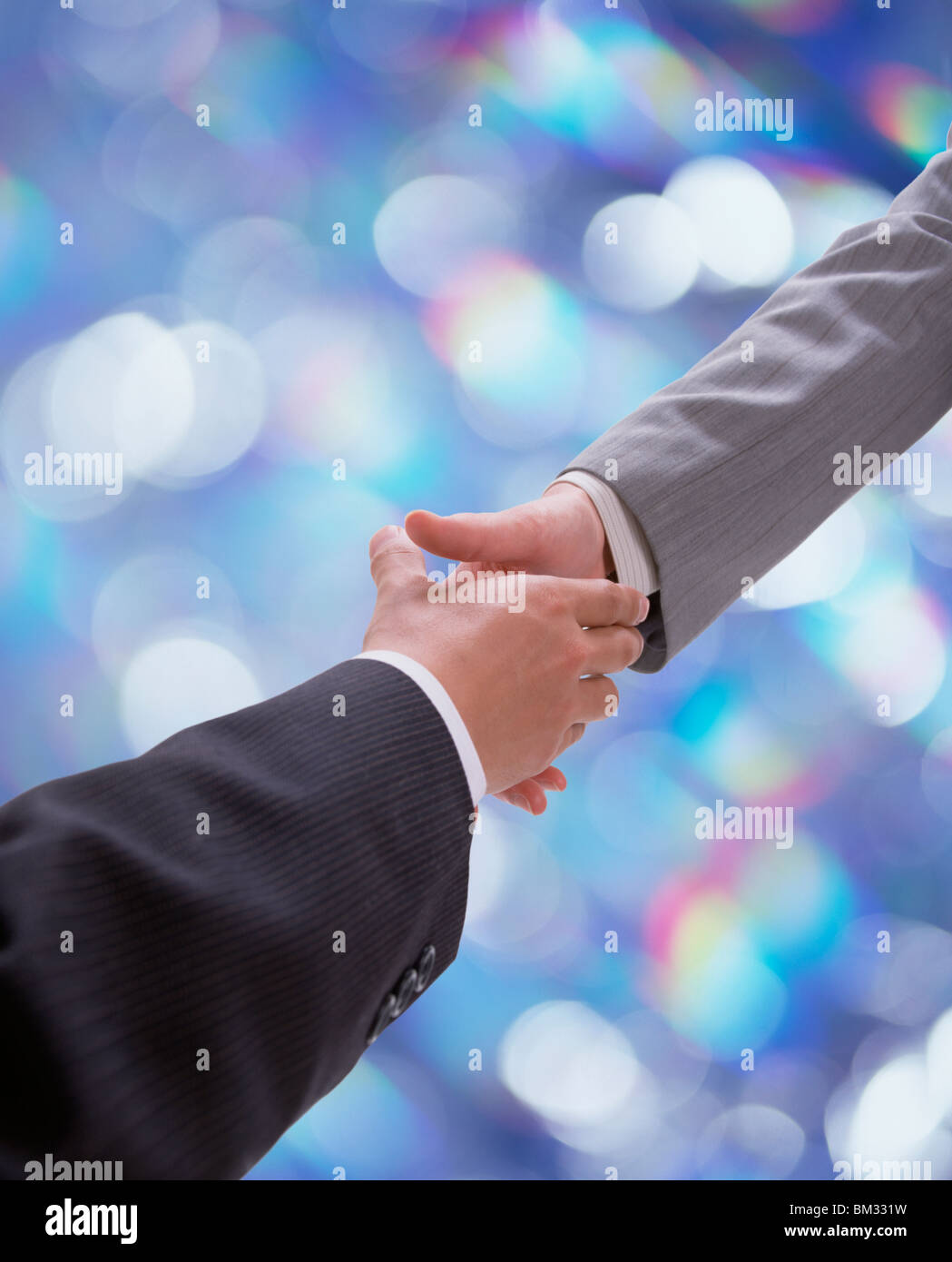 Two businessmen shaking hands, computer graphic, differential focus ...