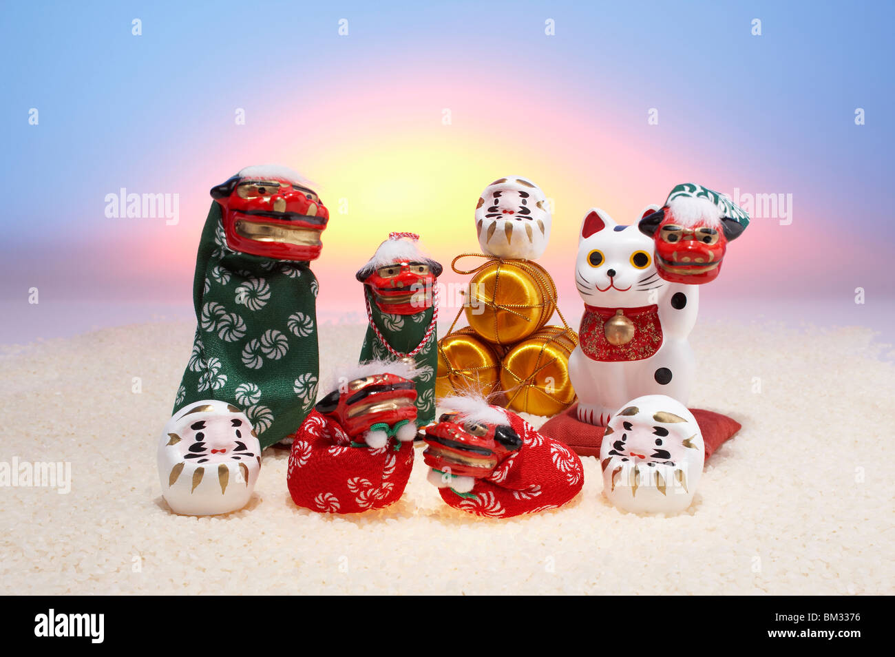 Japanese traditional dolls on rice, blue background Stock Photo - Alamy