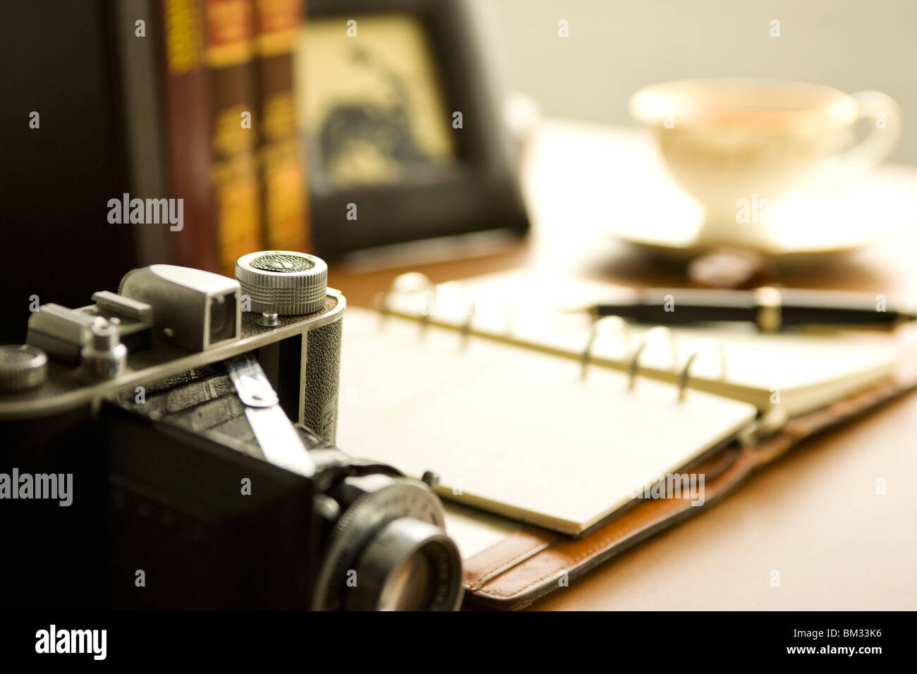 Camera on a desk Stock Photo - Alamy