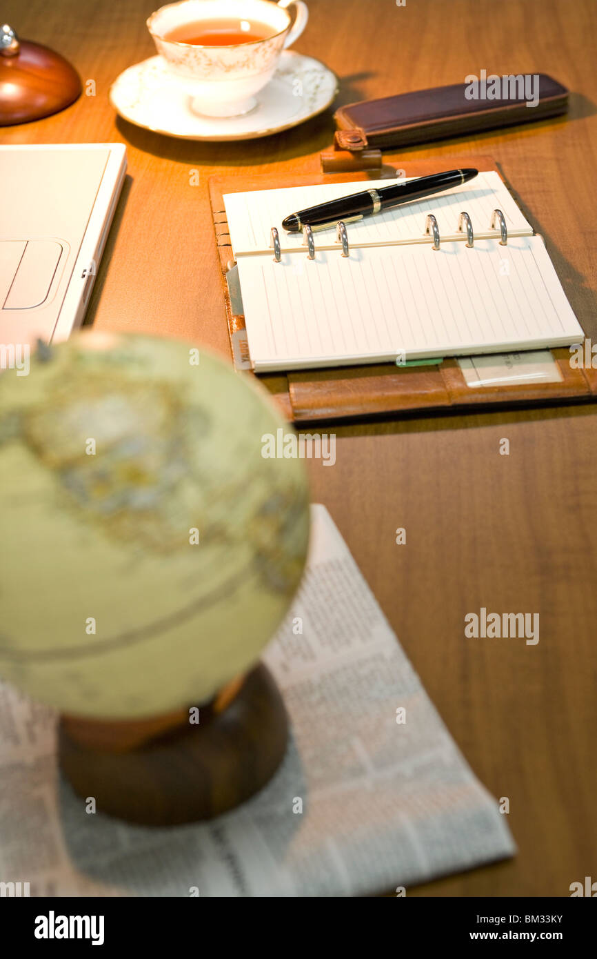Diary, ink pen and tea on a desk Stock Photo - Alamy