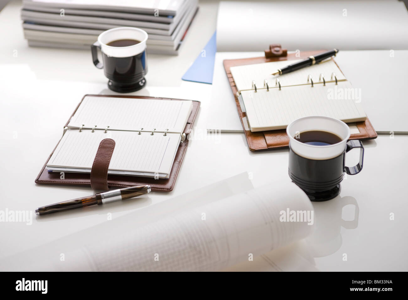 Coffee and diary on a desk Stock Photo - Alamy