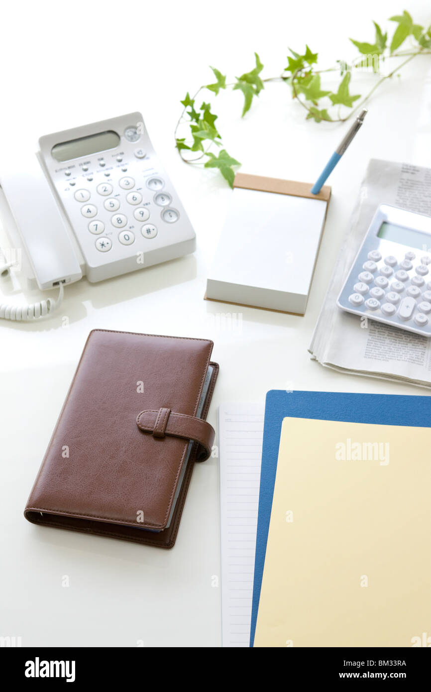 File, note pad and diary on office desk Stock Photo - Alamy