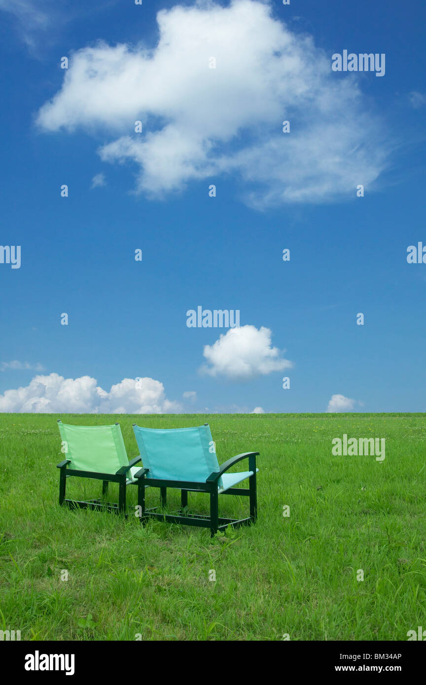 Two chairs in field Stock Photo - Alamy