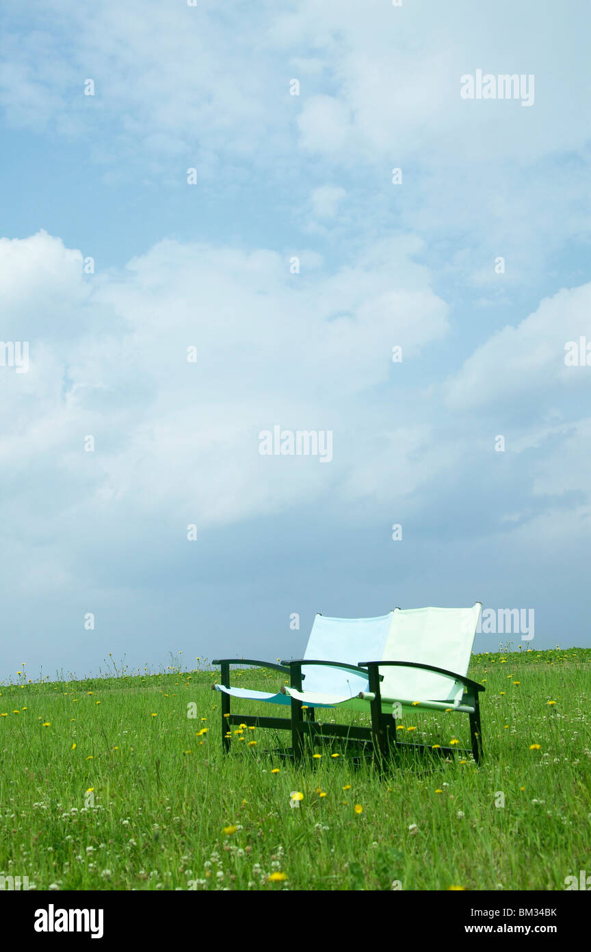Two chairs in field Stock Photo - Alamy