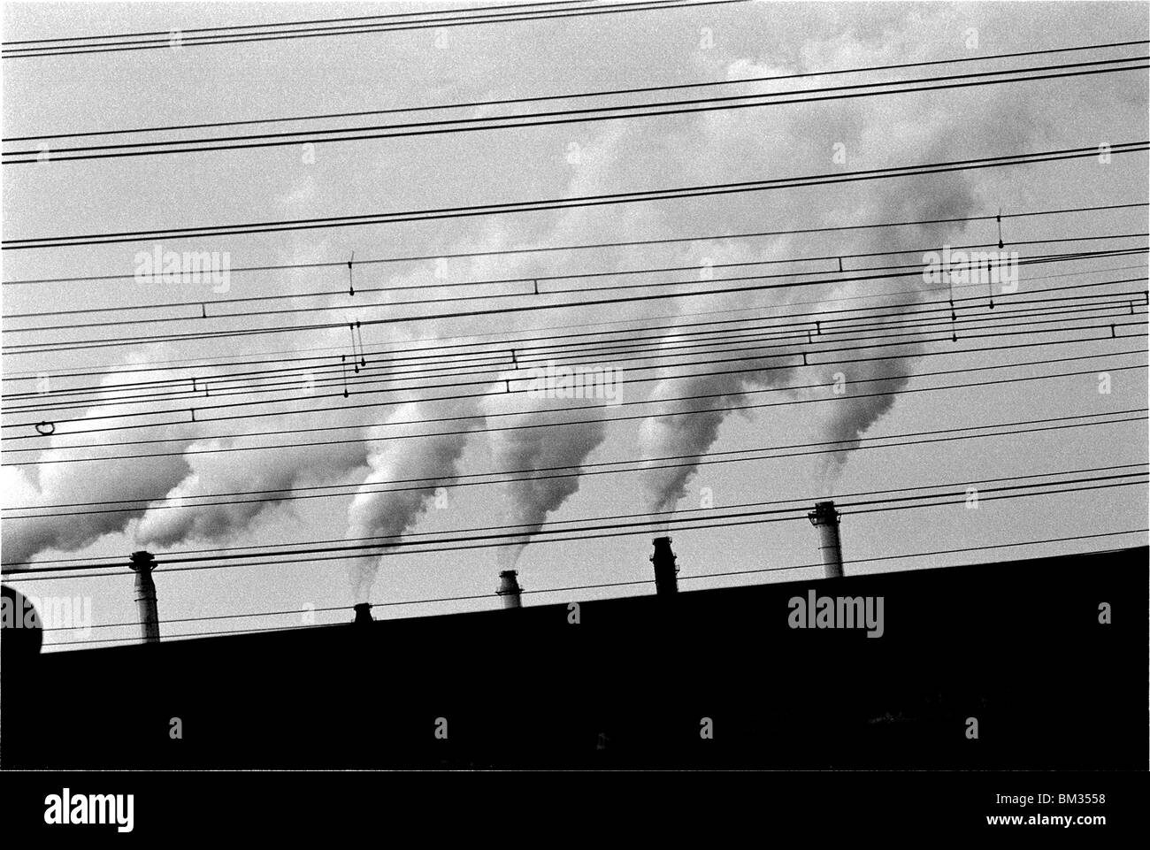 Smoke coming out of smoke stacks Stock Photo - Alamy