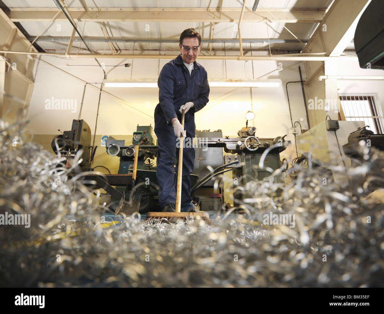 Worker sweeping factory hi-res stock photography and images - Alamy